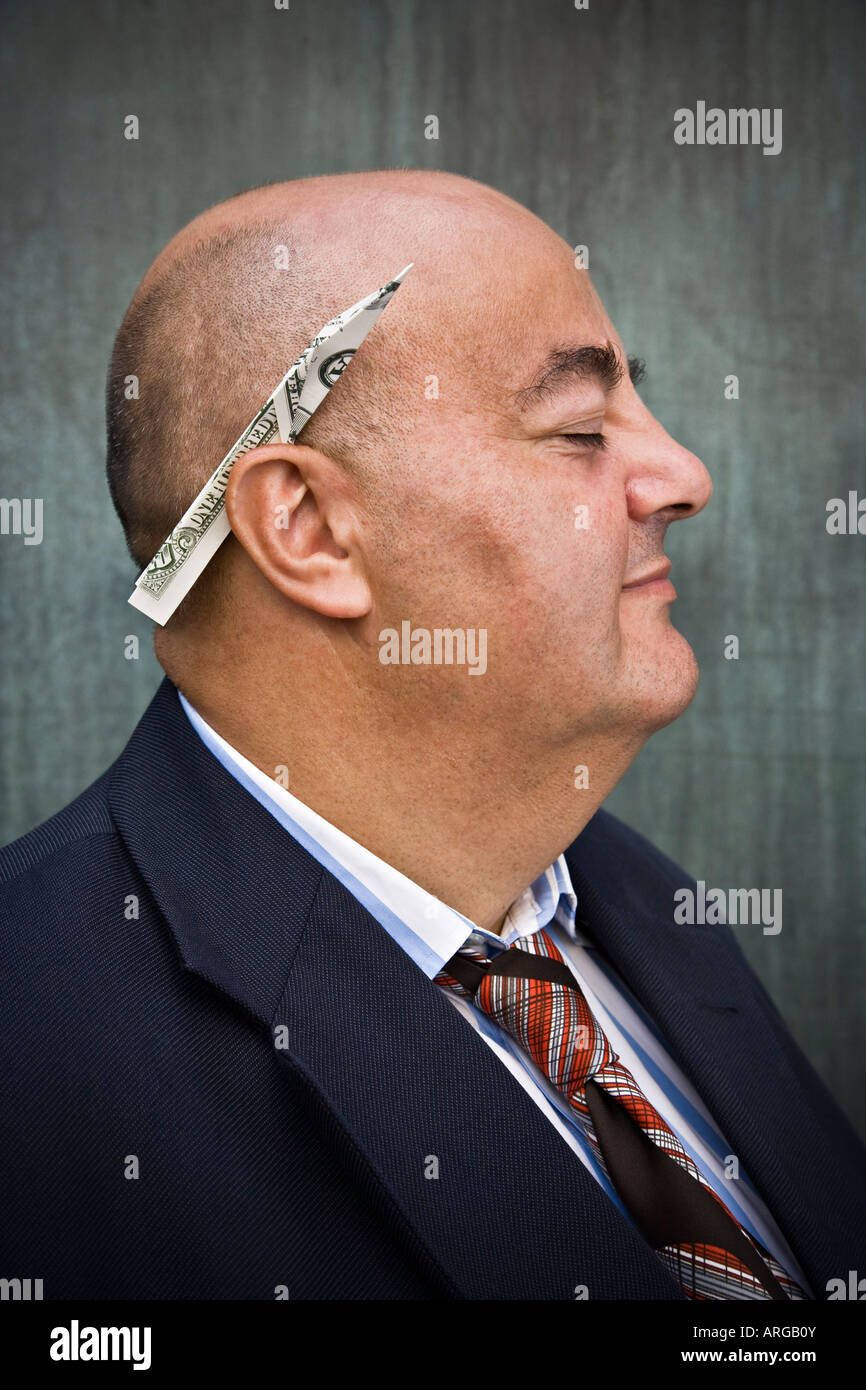 Portrait of Businessman with Dollar Bill Behind Ear Stock Photo - Alamy
