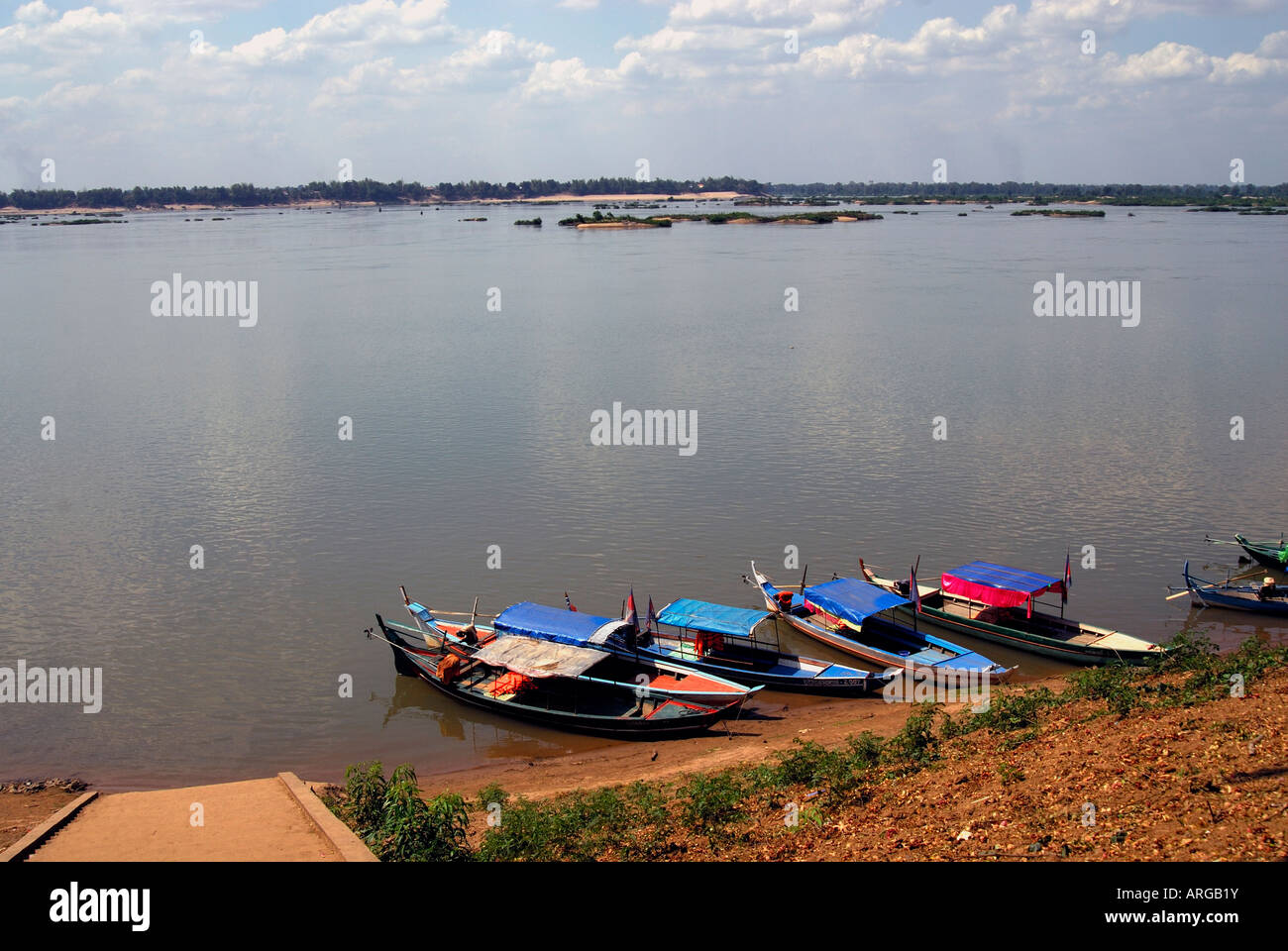 Tourist boats at Kampi Pool,Cambodia,dolphin viewing area Stock Photo ...