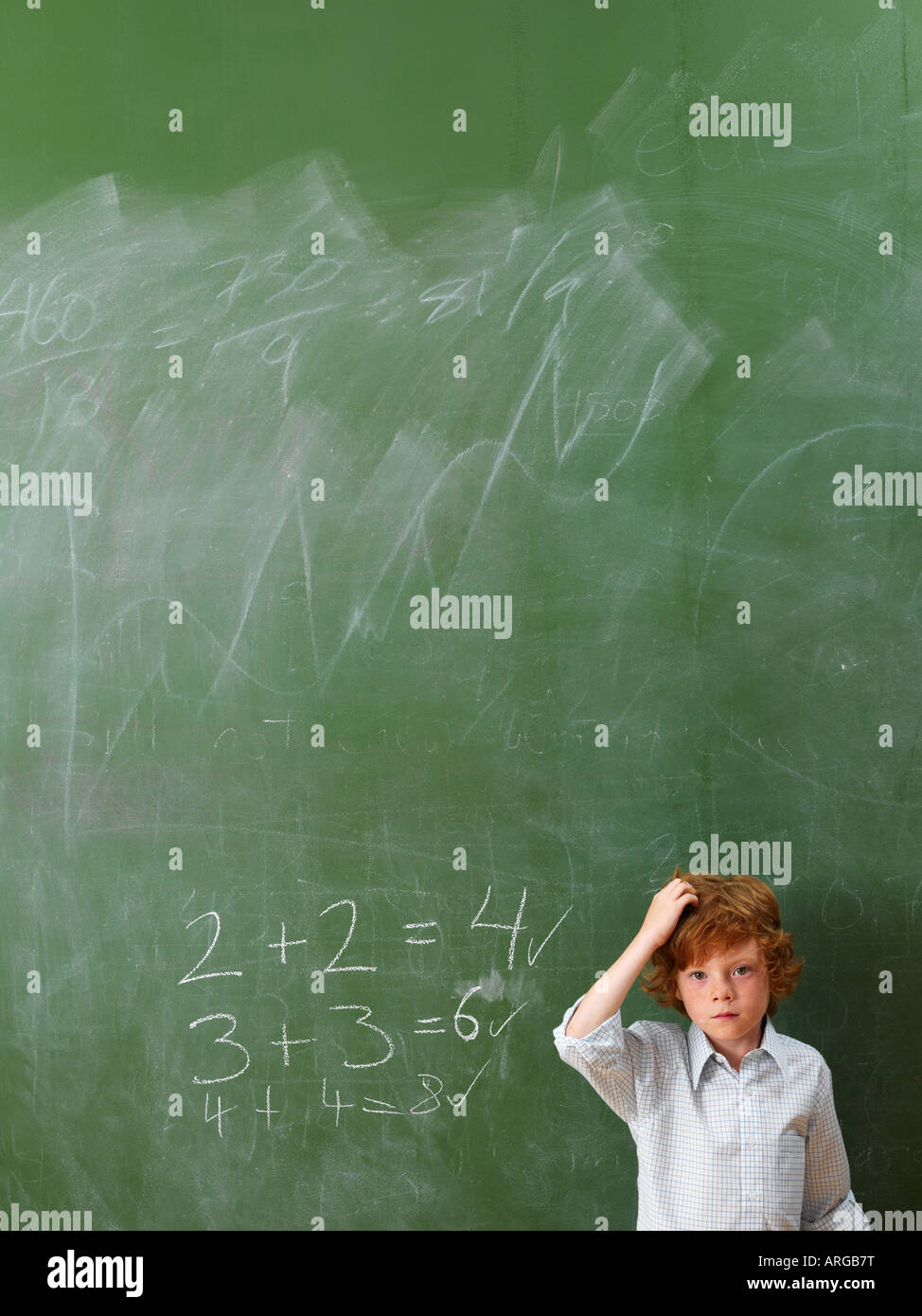 Boy Standing at Blackboard Stock Photo - Alamy