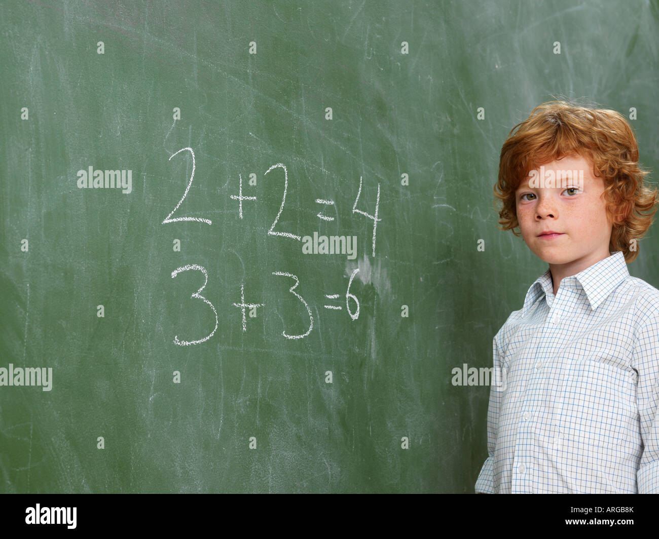 Boy at Blackboard Stock Photo - Alamy