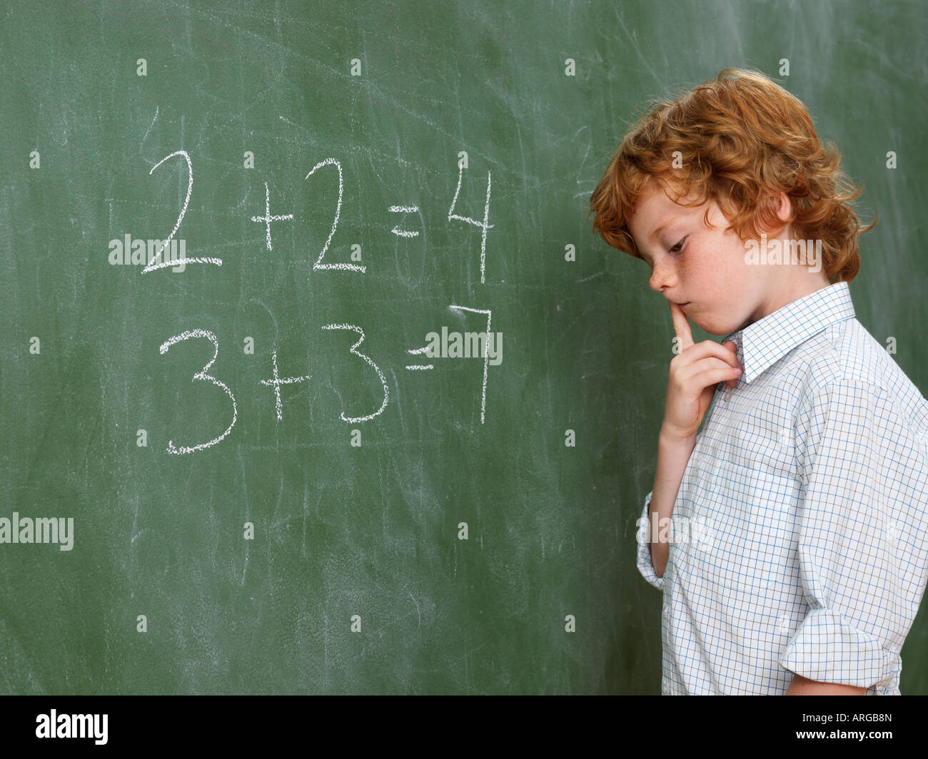 Boy at Blackboard Stock Photo - Alamy