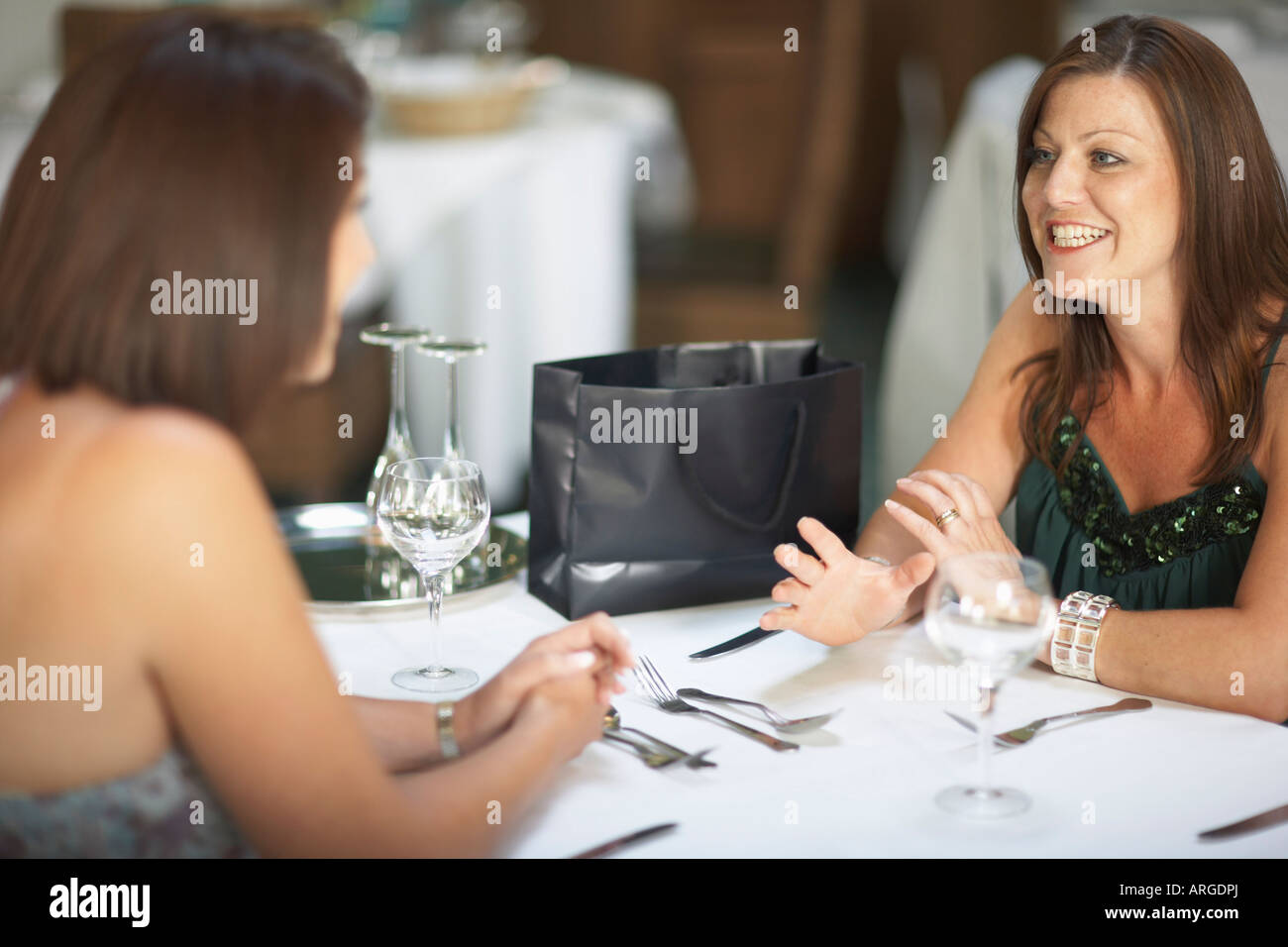 Women Laughing Restaurant Table High Resolution Stock Photography and ...