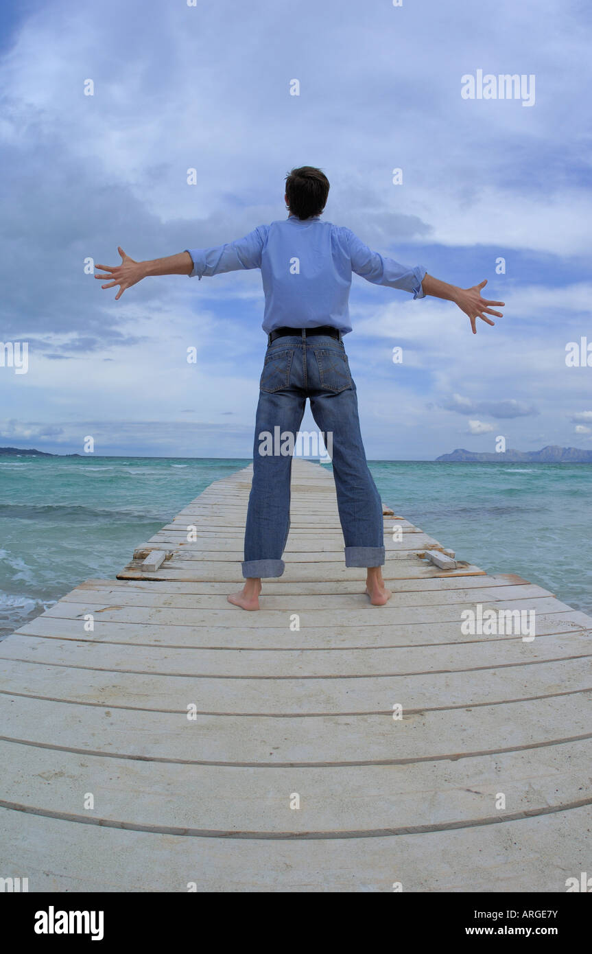 Man Standing on Pier Stock Photo - Alamy