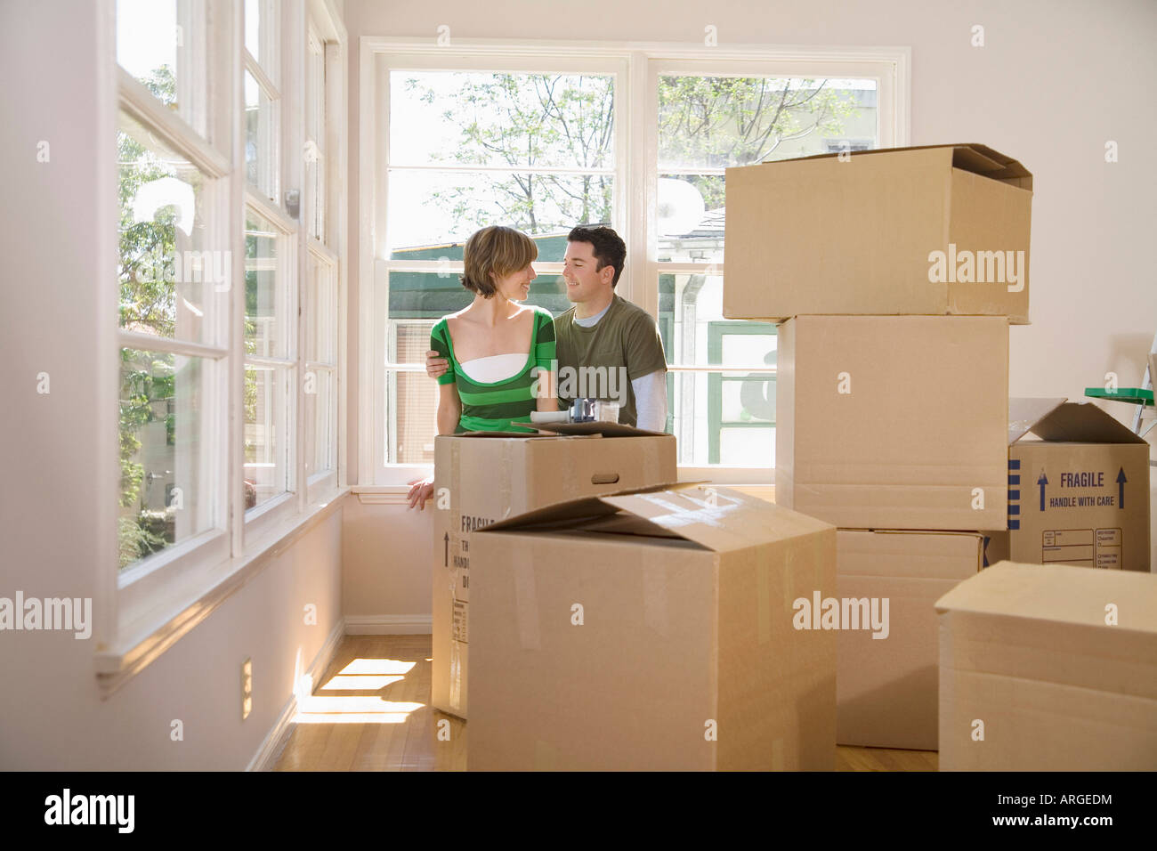 Couple Moving Into New Home Stock Photo - Alamy