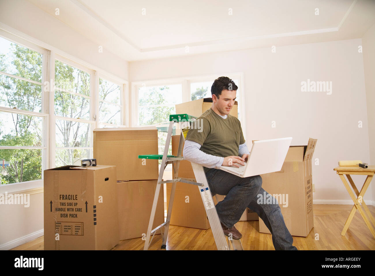 Man Moving Into New Home Stock Photo - Alamy
