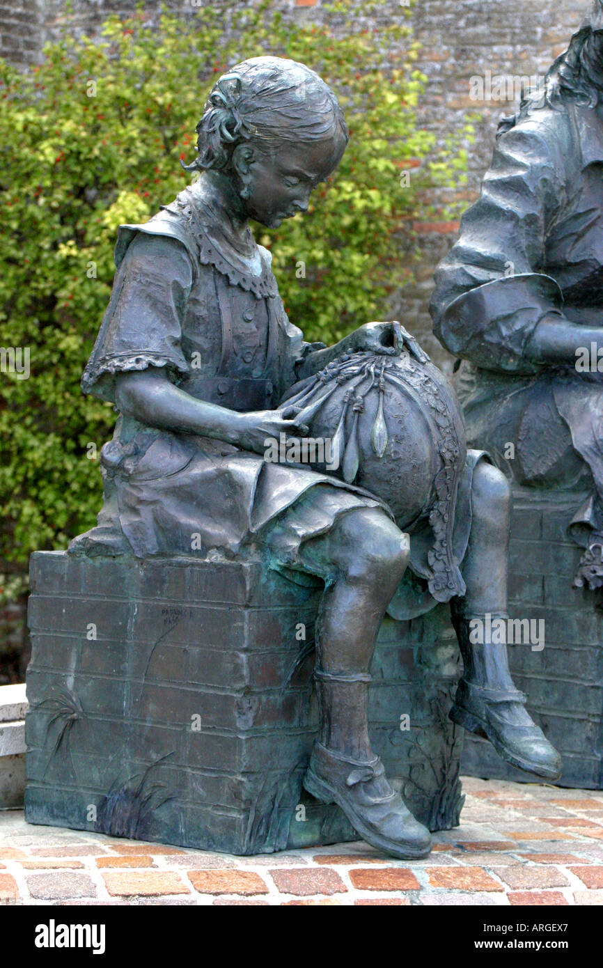Young girl is part of the statue group of lacemakers at Offida where ...
