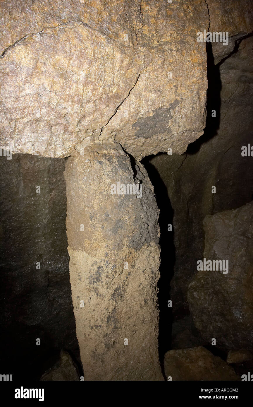 naturally formed stone column holding up large rock Stock Photo - Alamy