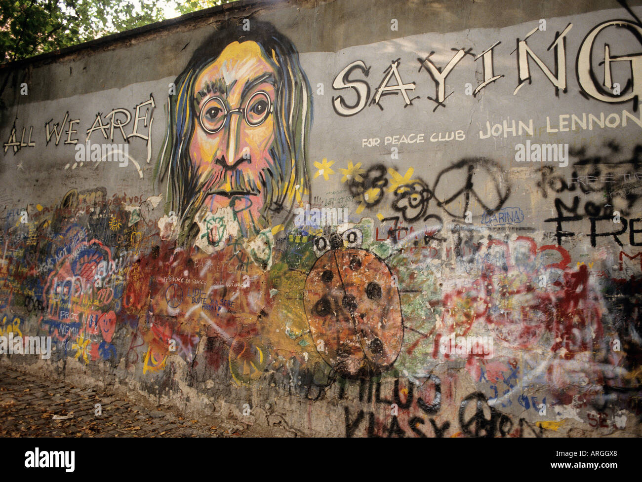 Detail of the graffiti daubed over the years on the John Lennon Wall ...