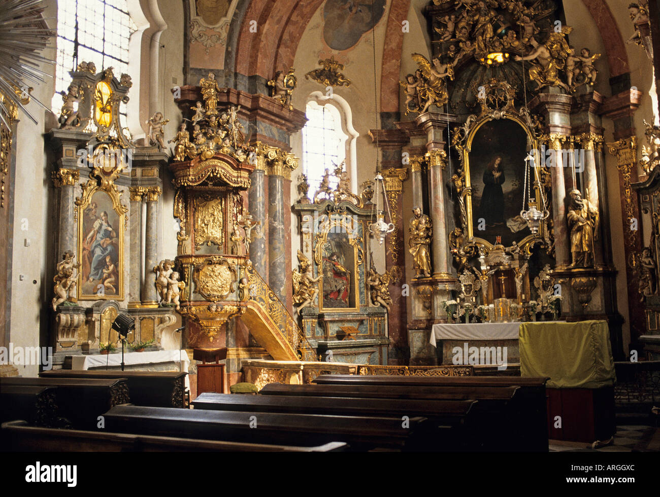 The interior encrusted with gilded decoration around pink marble ...