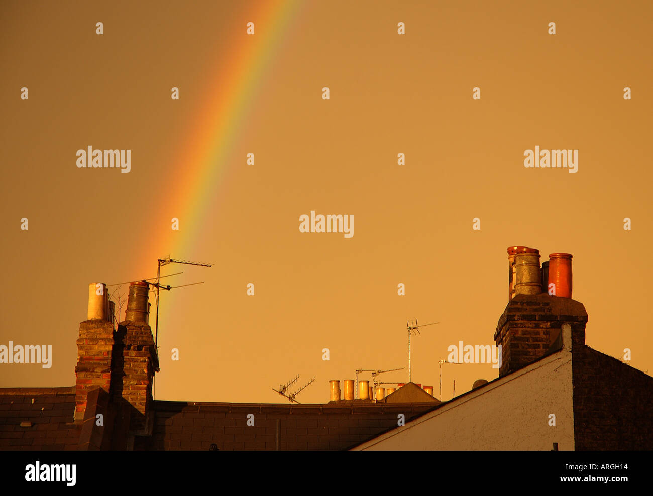 Rainbow over the rooftops of old Victorian houses in Central London ...