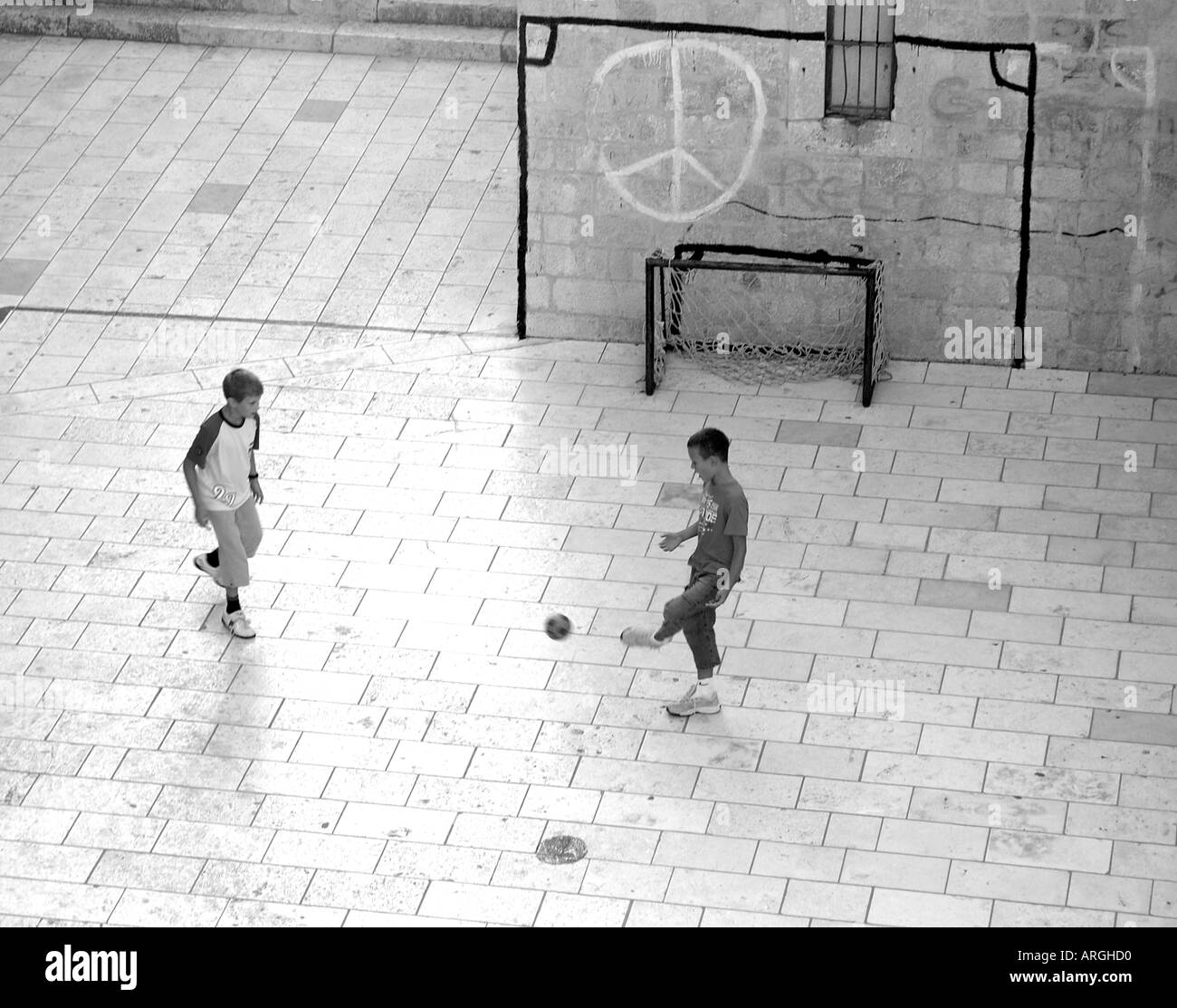 Two Kids playing urban football in Dubrovnik Centre in Croatia Stock ...
