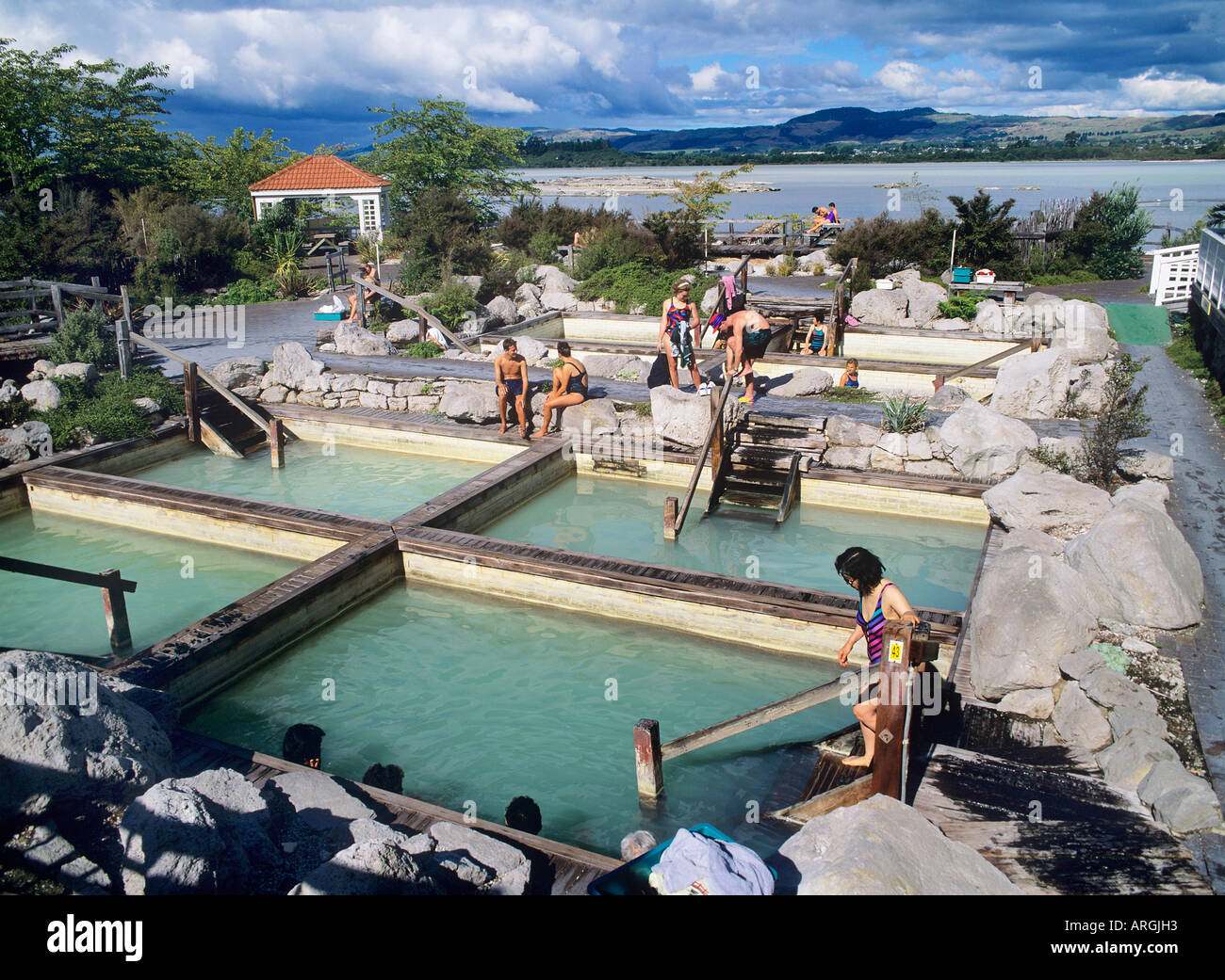 A few people bathing in the healing waters of the Polynesian Pools ...