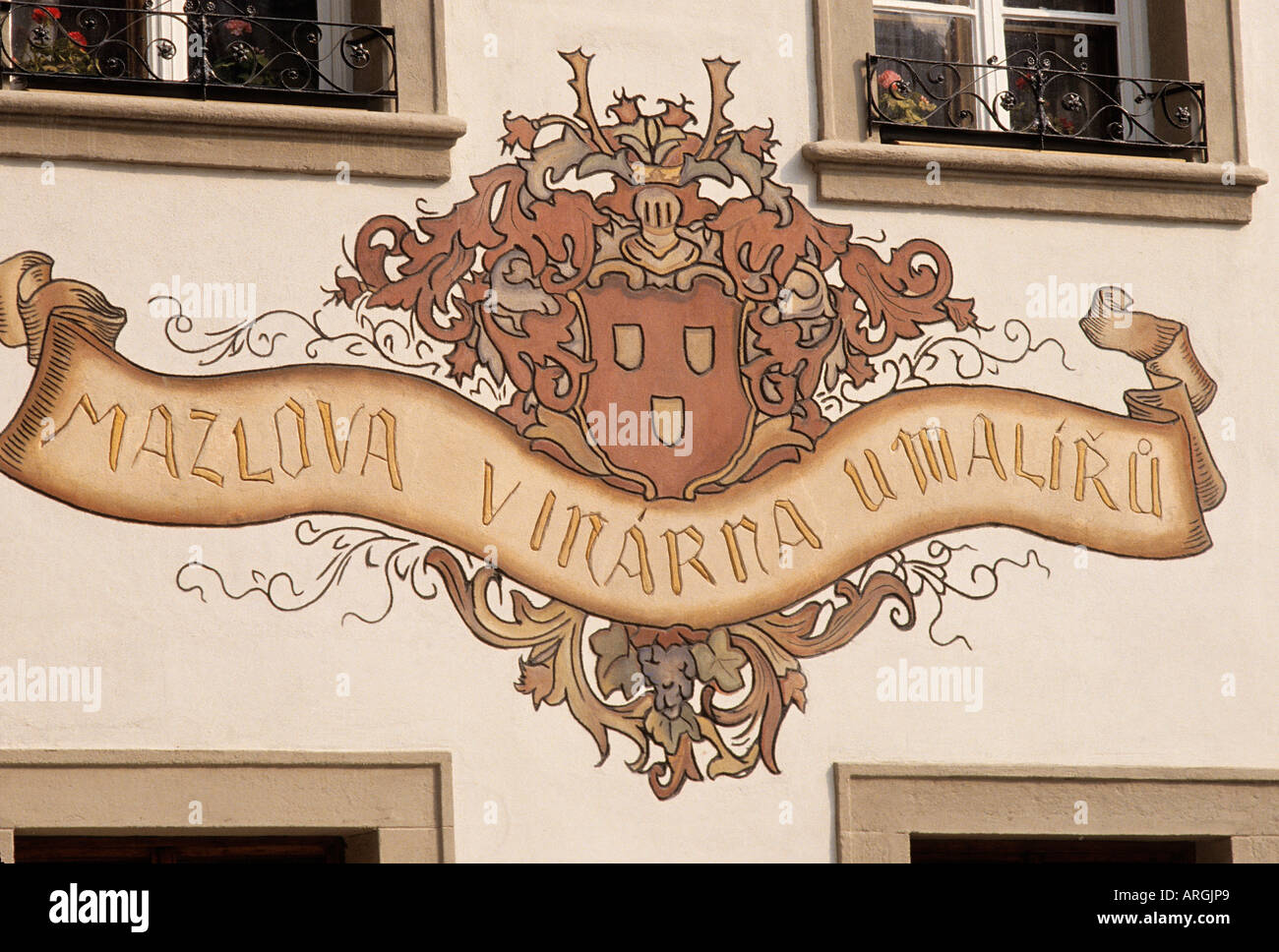 The painted sign featuring a crest of the Mazlova Vinarna U Maliru wine ...