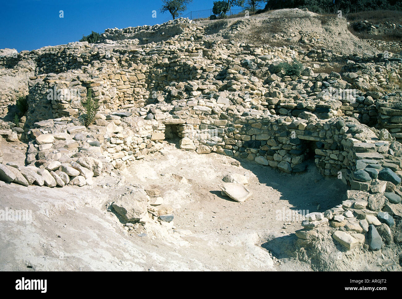The remains of the round stone dwellings at the site of Khirokitia ...