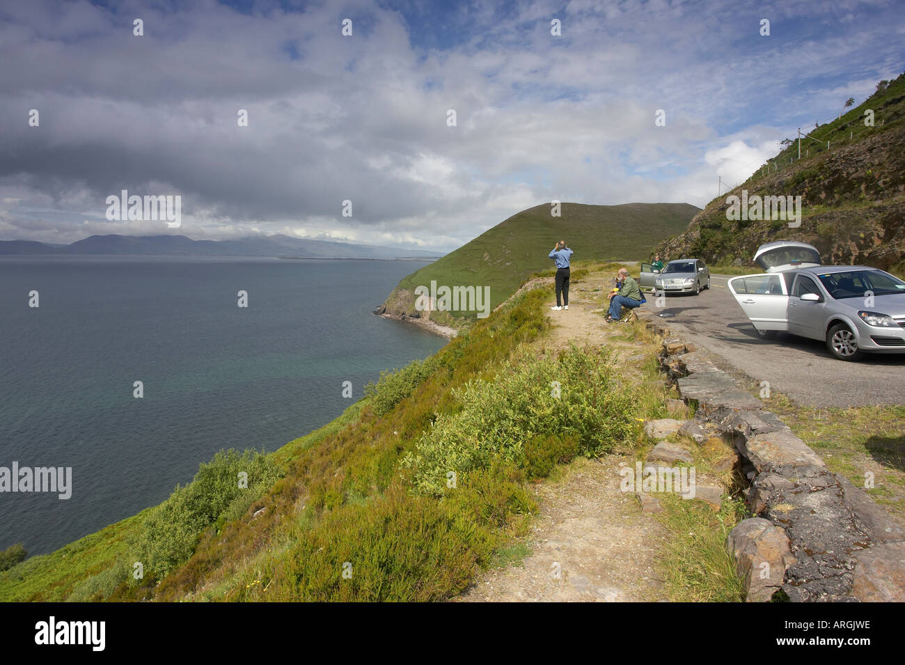 tourists stop at a rest stop on the Iveragh peninsula Ring of Kerry ...