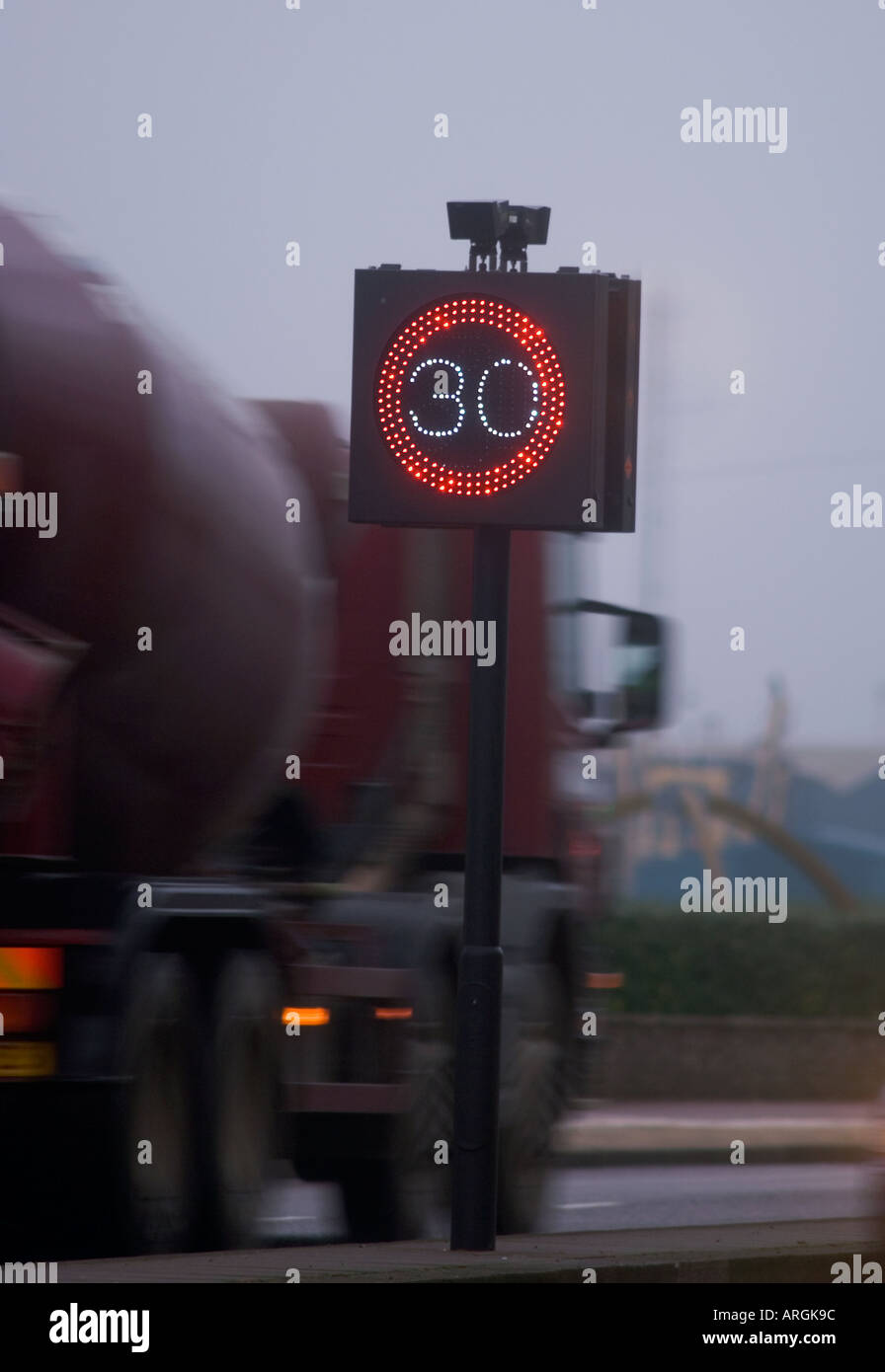 Speed camera and illuminated limit warning sign Stock Photo - Alamy