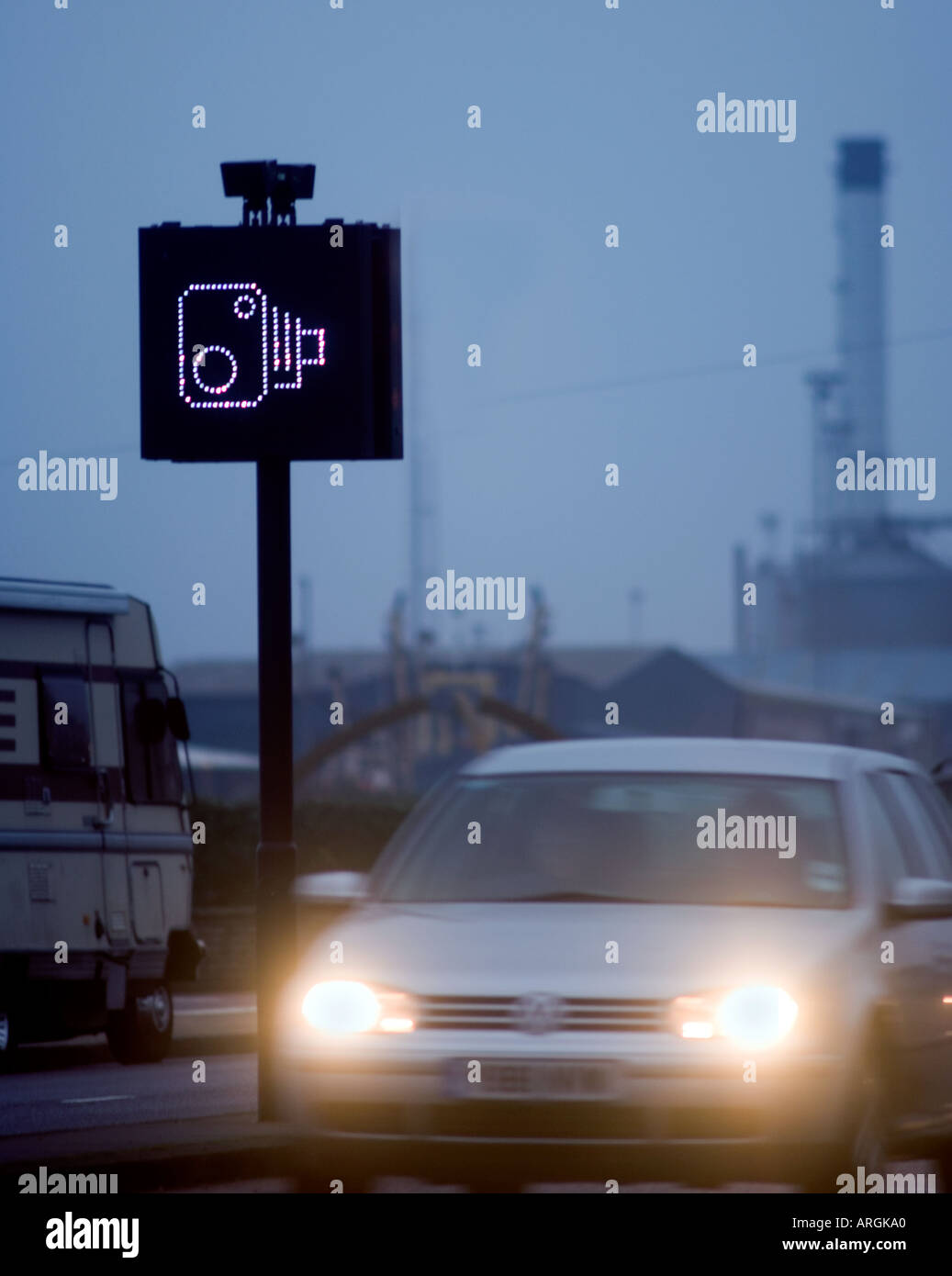 Speed camera and illuminated limit warning sign Stock Photo - Alamy
