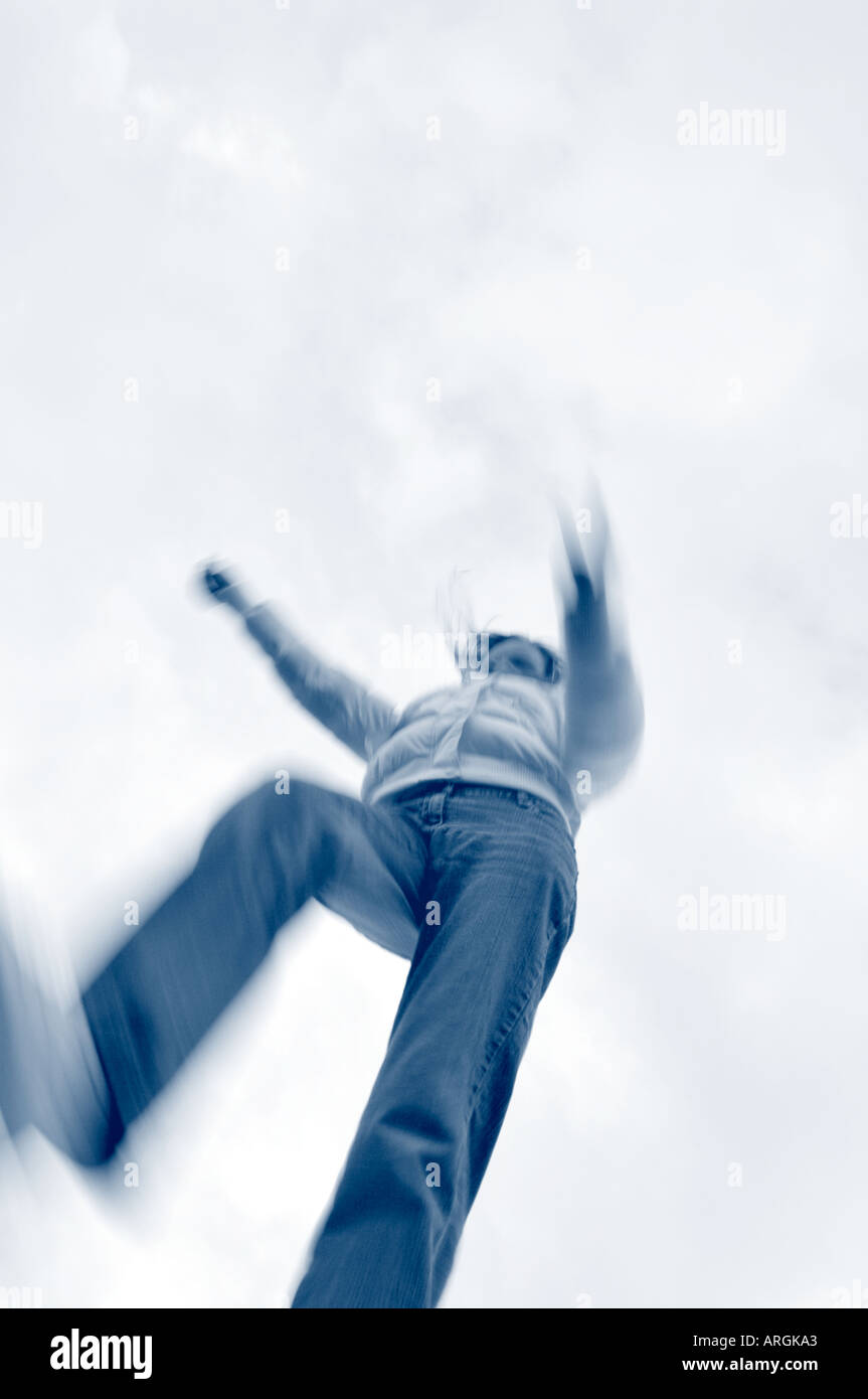 Teenage girl jumping over the camera Stock Photo - Alamy