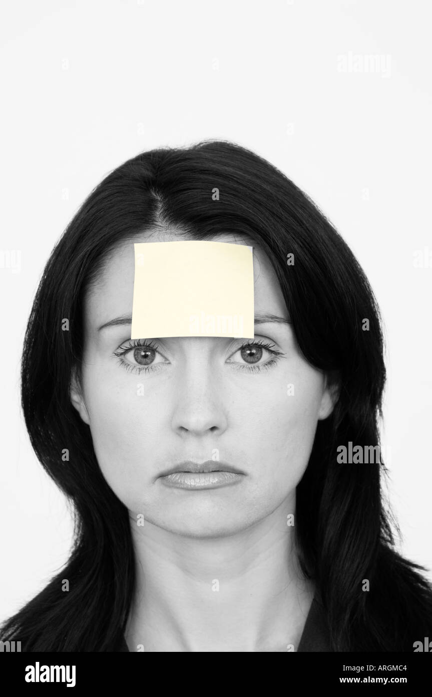 sad business woman with a blank post it note on her head Stock Photo ...