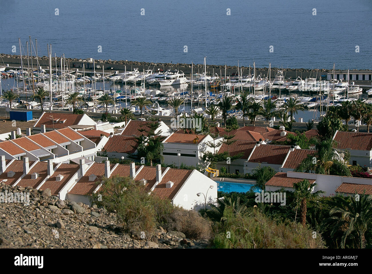 An attractive housing development of red roofed buildings with ...