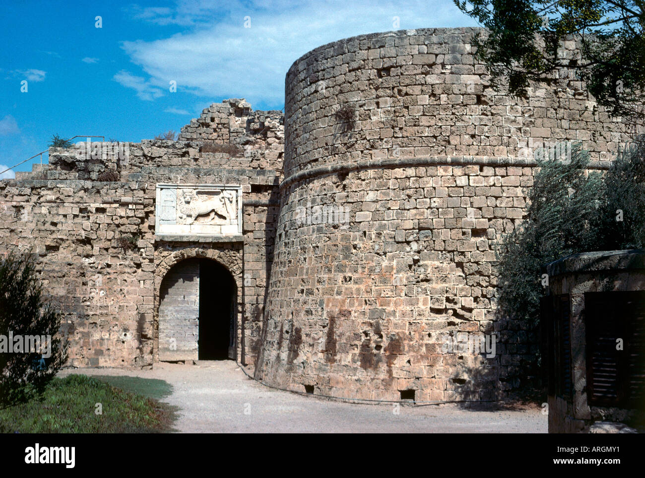 A large carved stone plaque set above the arched entrance of the ...