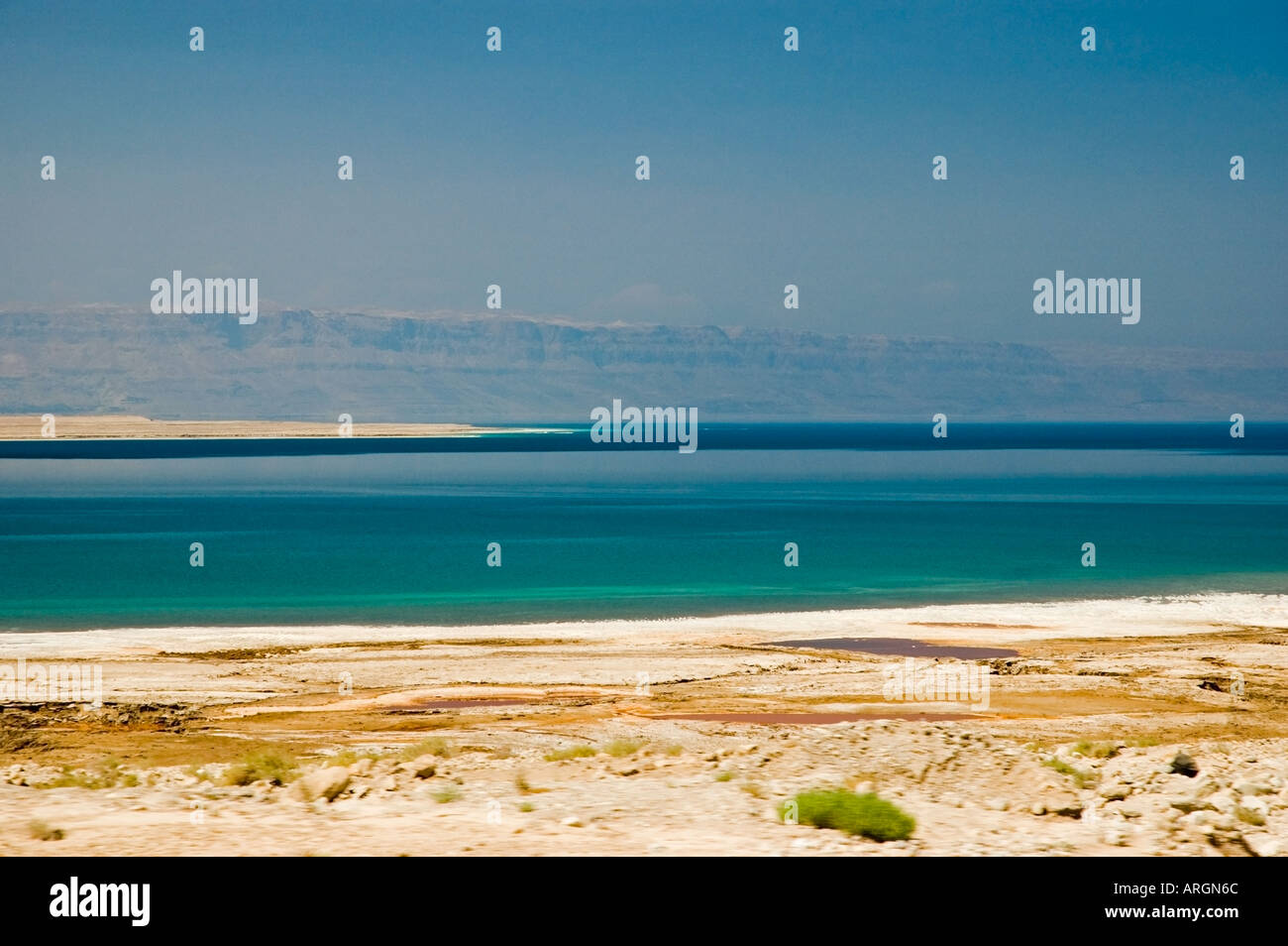 Salt encrusted shoreline, Dead Sea, West Bank, Palestine, in far ...