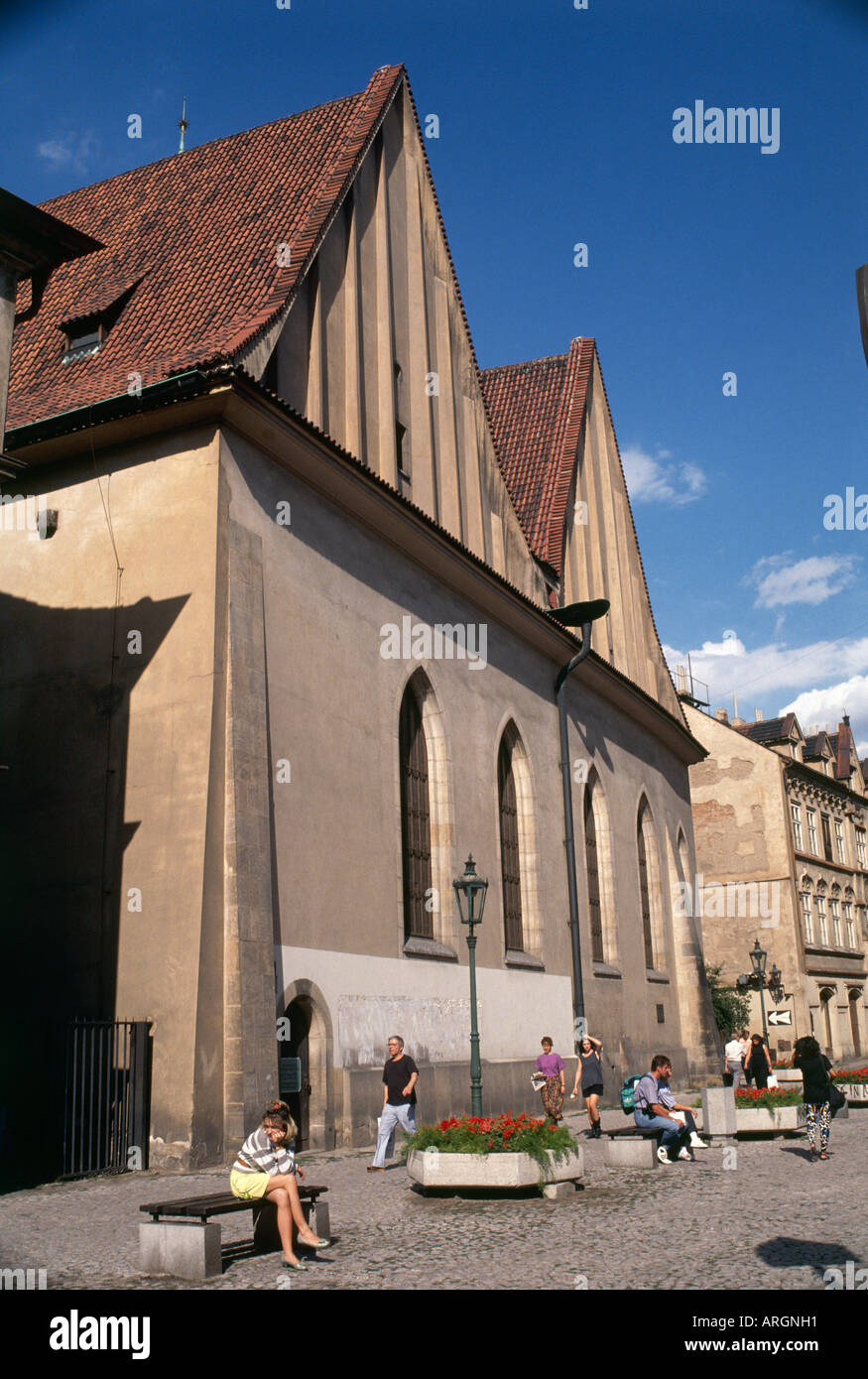 People seated outside the tall twin gabled Bethlehem Chapel founded in ...
