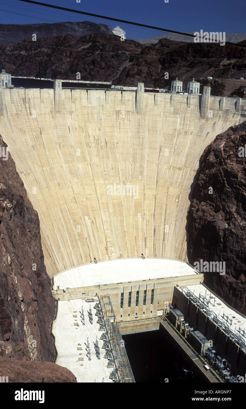 The towering and complex concrete structure of the Hoover Dam spanning ...
