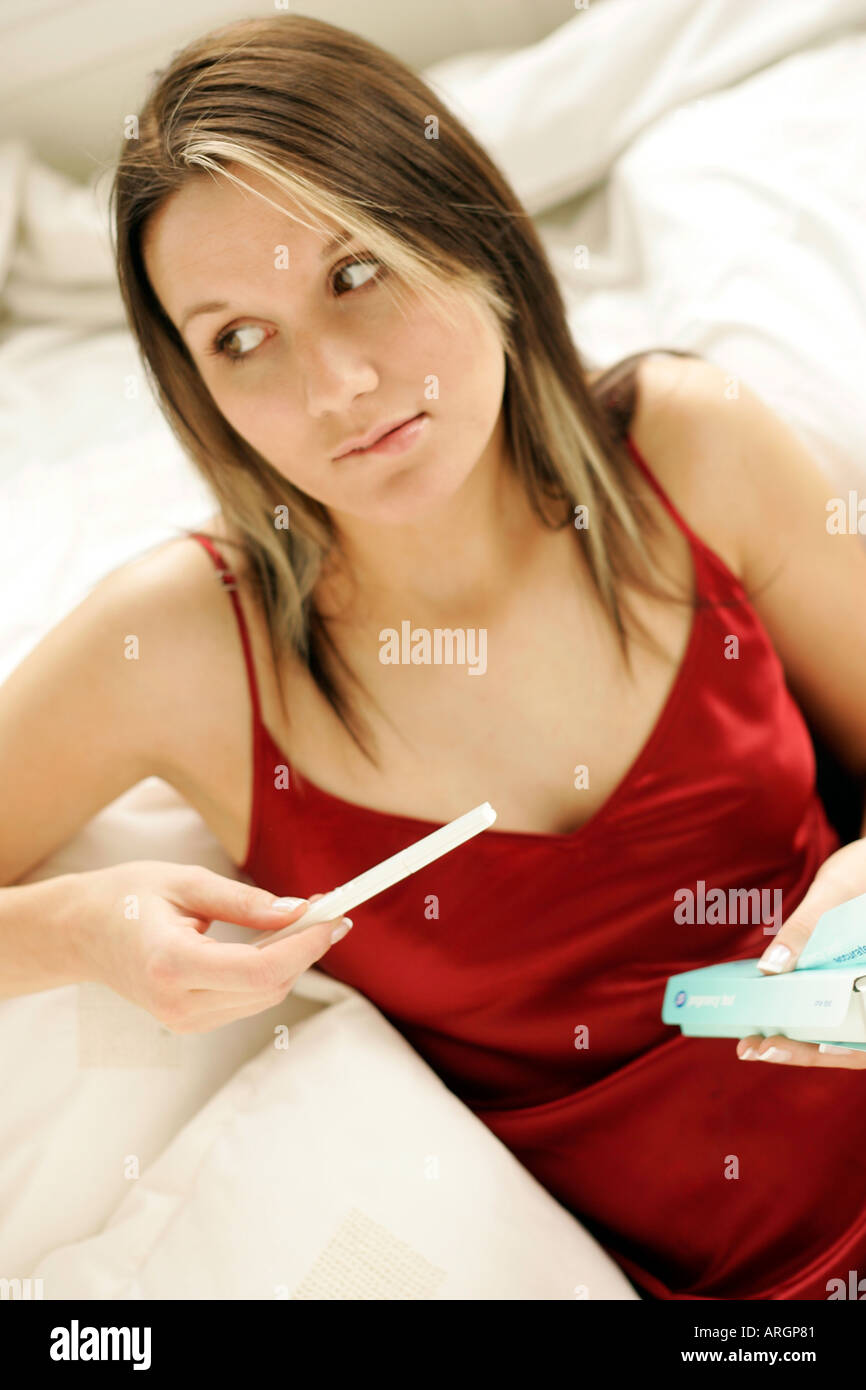 Girl with pregnancy test Stock Photo - Alamy