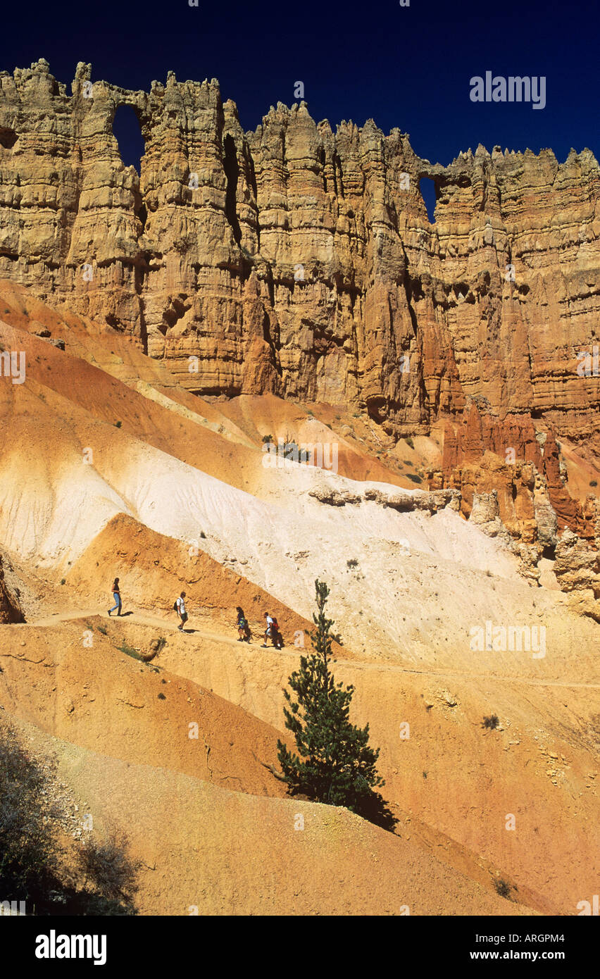 Visitors beneath some of the openings in a section of the soft red ...