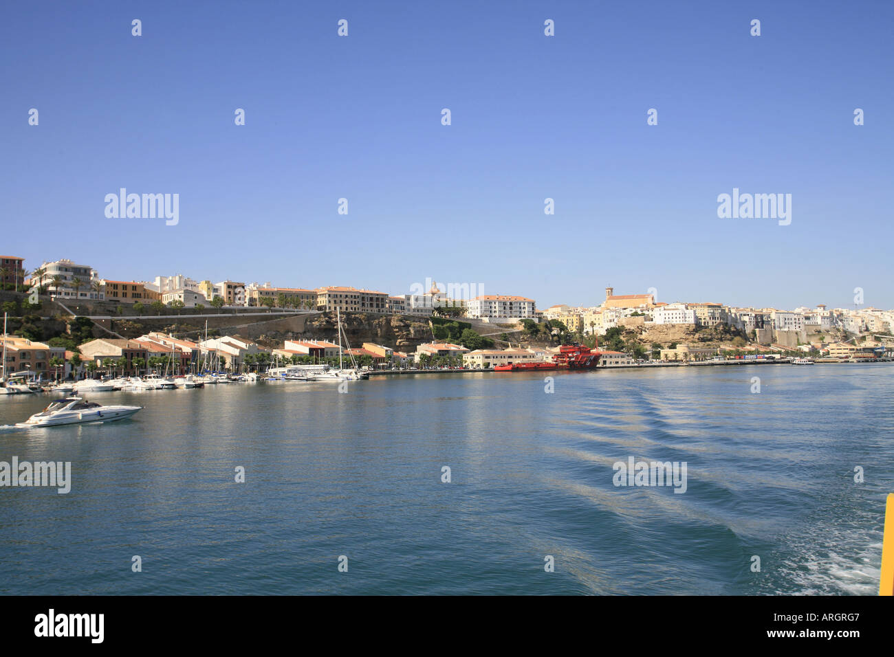 The waterfront from a boat at Mao, in the estuary at Mao, Menorca ...