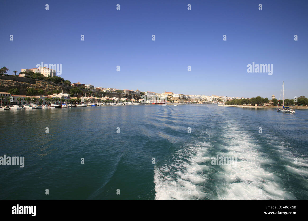 The waterfront from a boat at Mao, in the estuary at Mao, Menorca ...