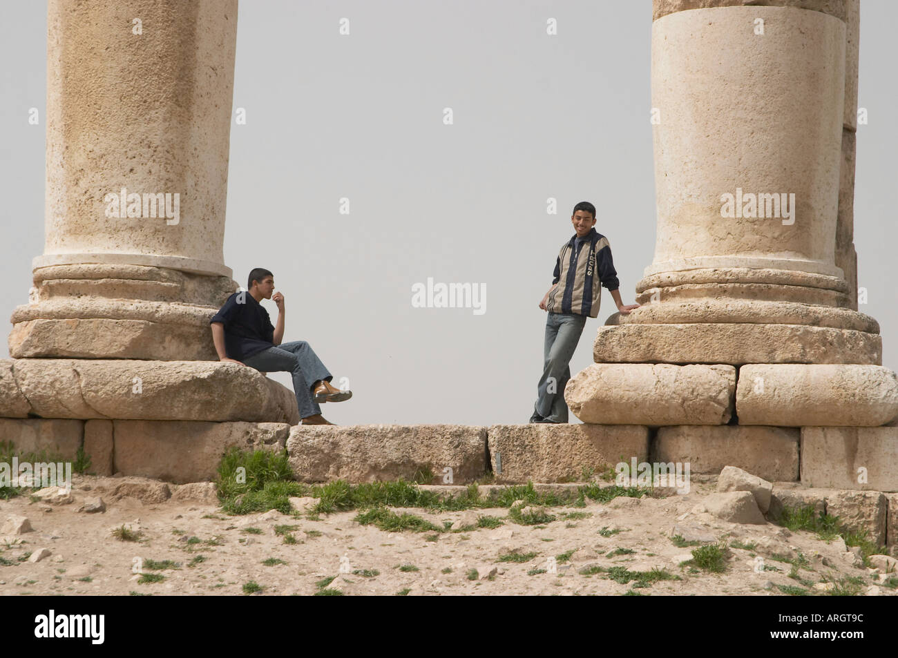 two men at Ruins of old Amman capital of Jordan Stock Photo - Alamy