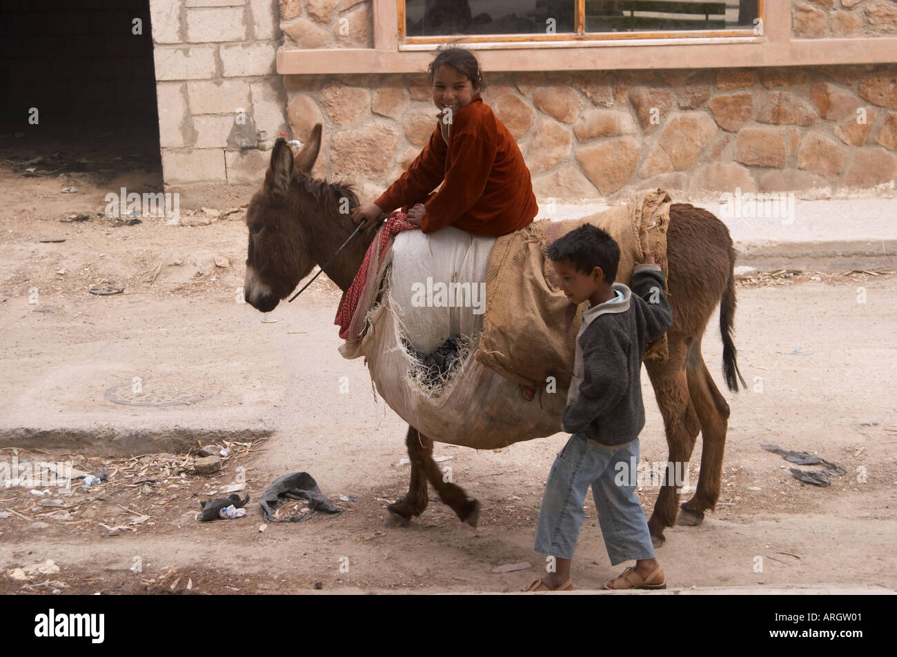 Palmyra Syria Boy and girl on a donkey or mule Stock Photo - Alamy