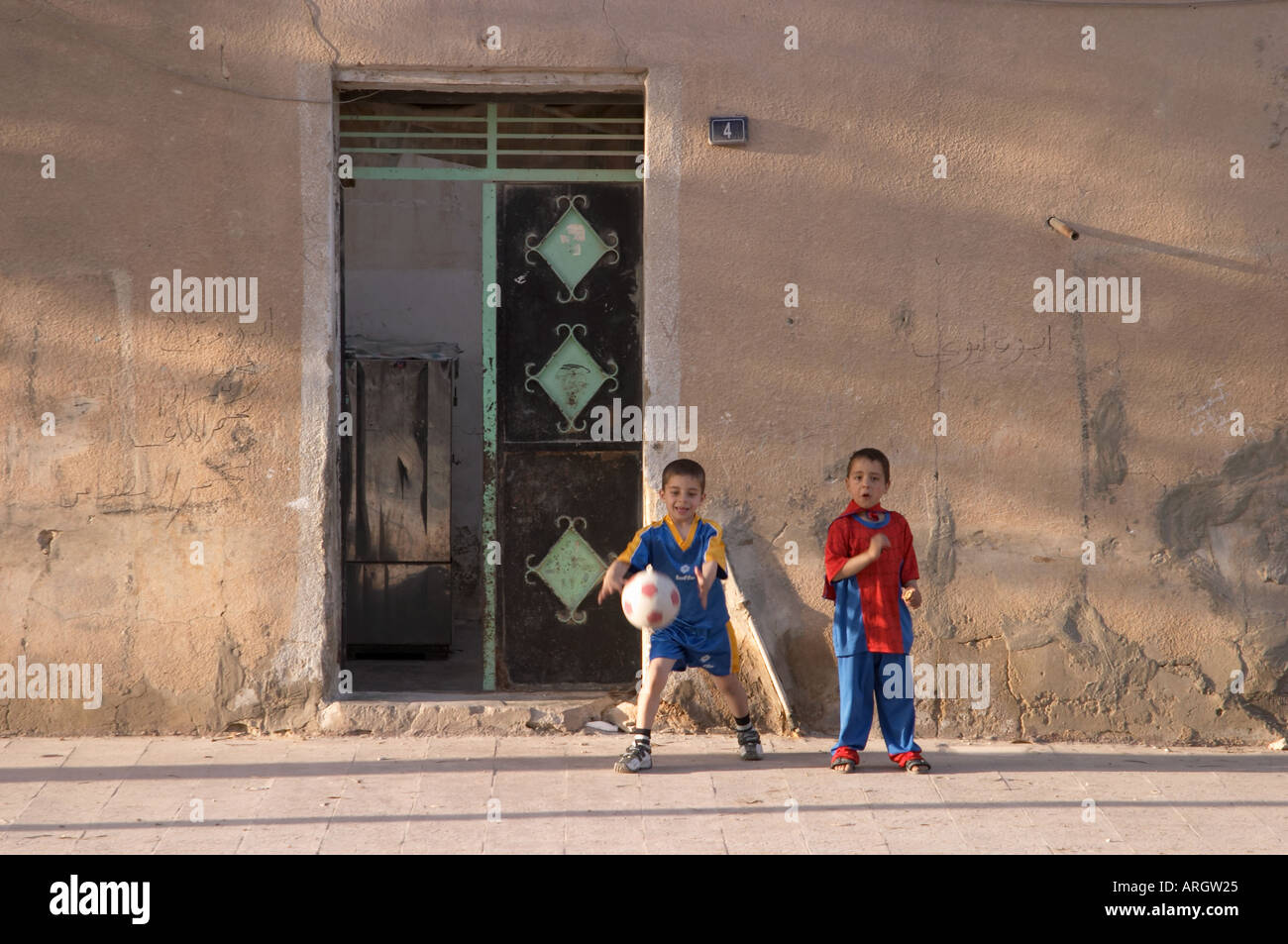 Muslim children playing on arab street hi-res stock photography and ...