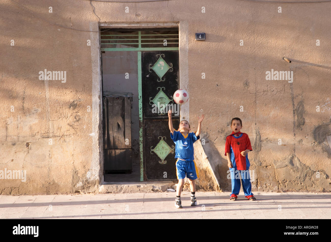 Palmyra Syria Children playing with ball on the street Stock Photo - Alamy
