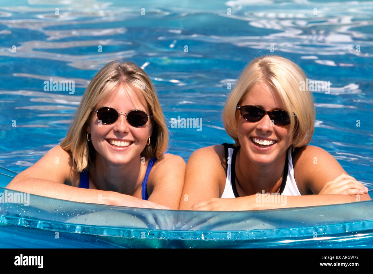 Woman in swimsuit laying pool hi-res stock photography and images - Alamy