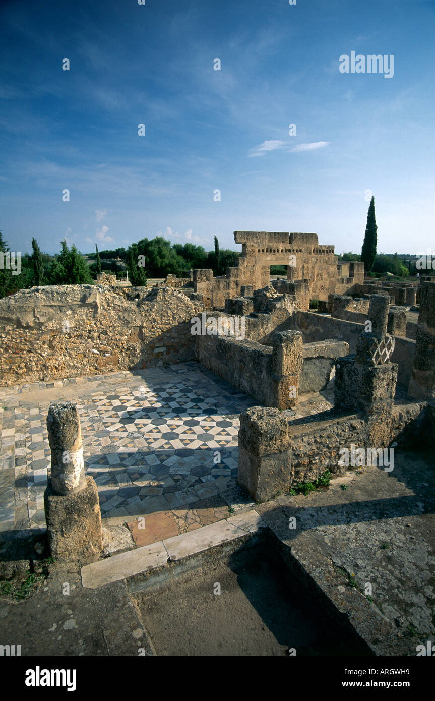 Viewed beyond the extensive remains of a mosaic floor the ruins of the ...