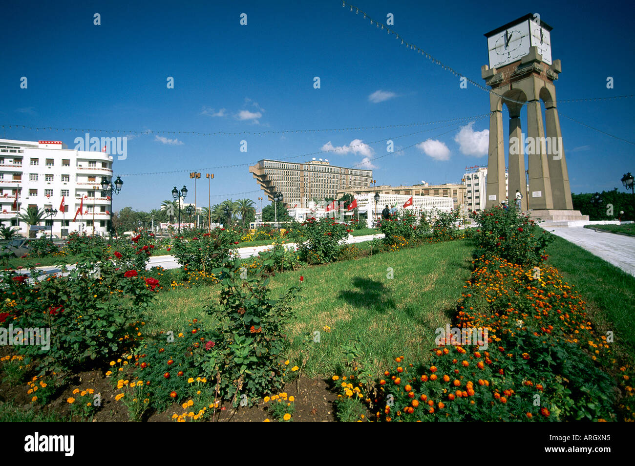 A massive four faced clock tower dominating the centre and looming over ...