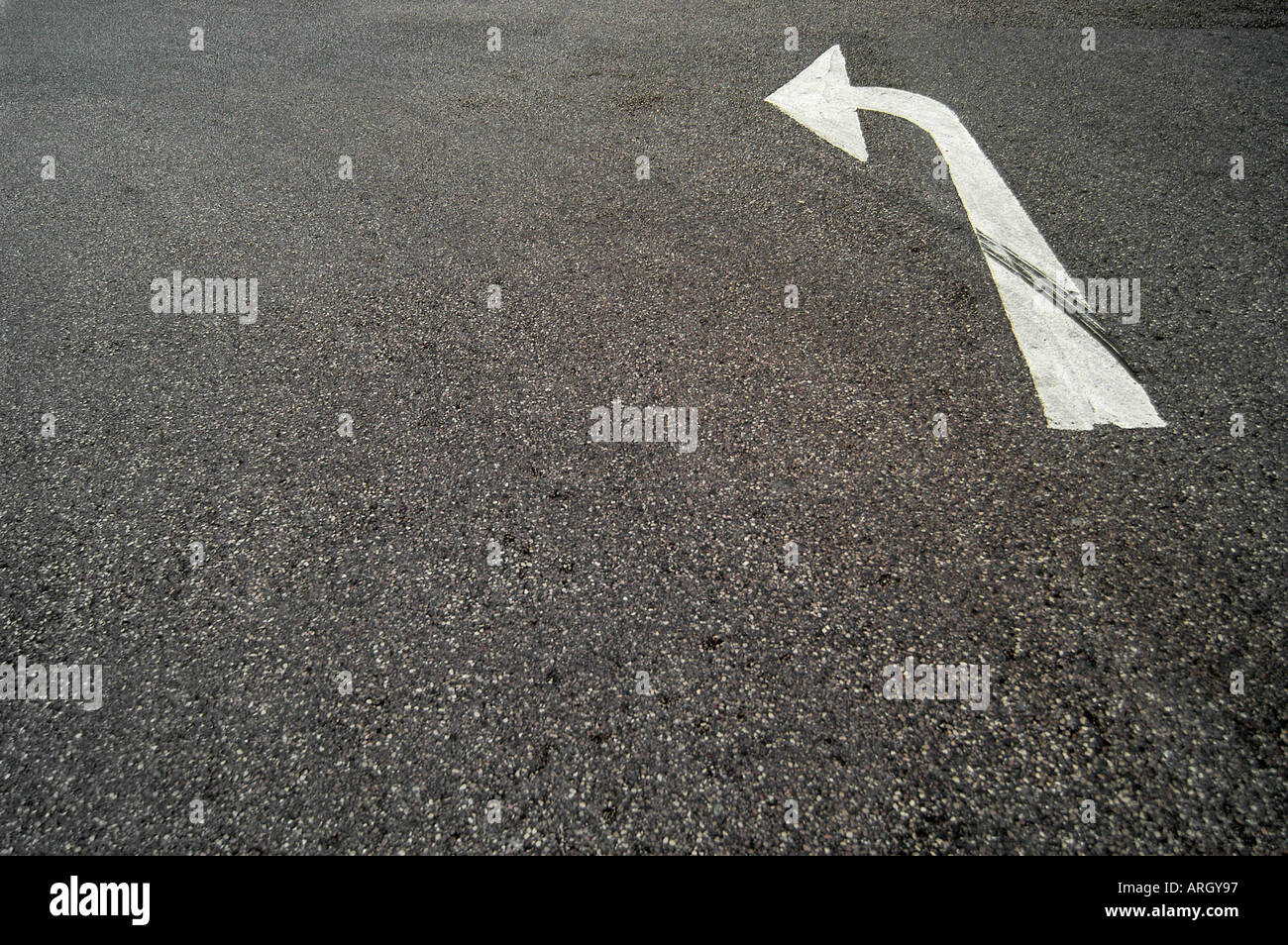 Turn left symbol painted on a tarmac road surface Stock Photo - Alamy