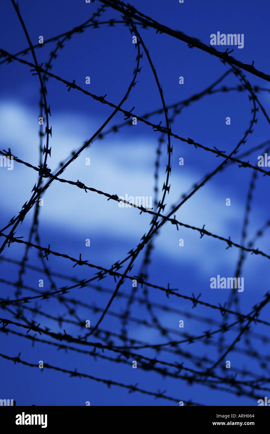 Security fence wire razor wire surveillance Stock Photo - Alamy