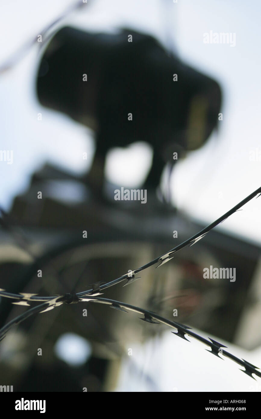 Security fence wire razor wire surveillance Stock Photo - Alamy