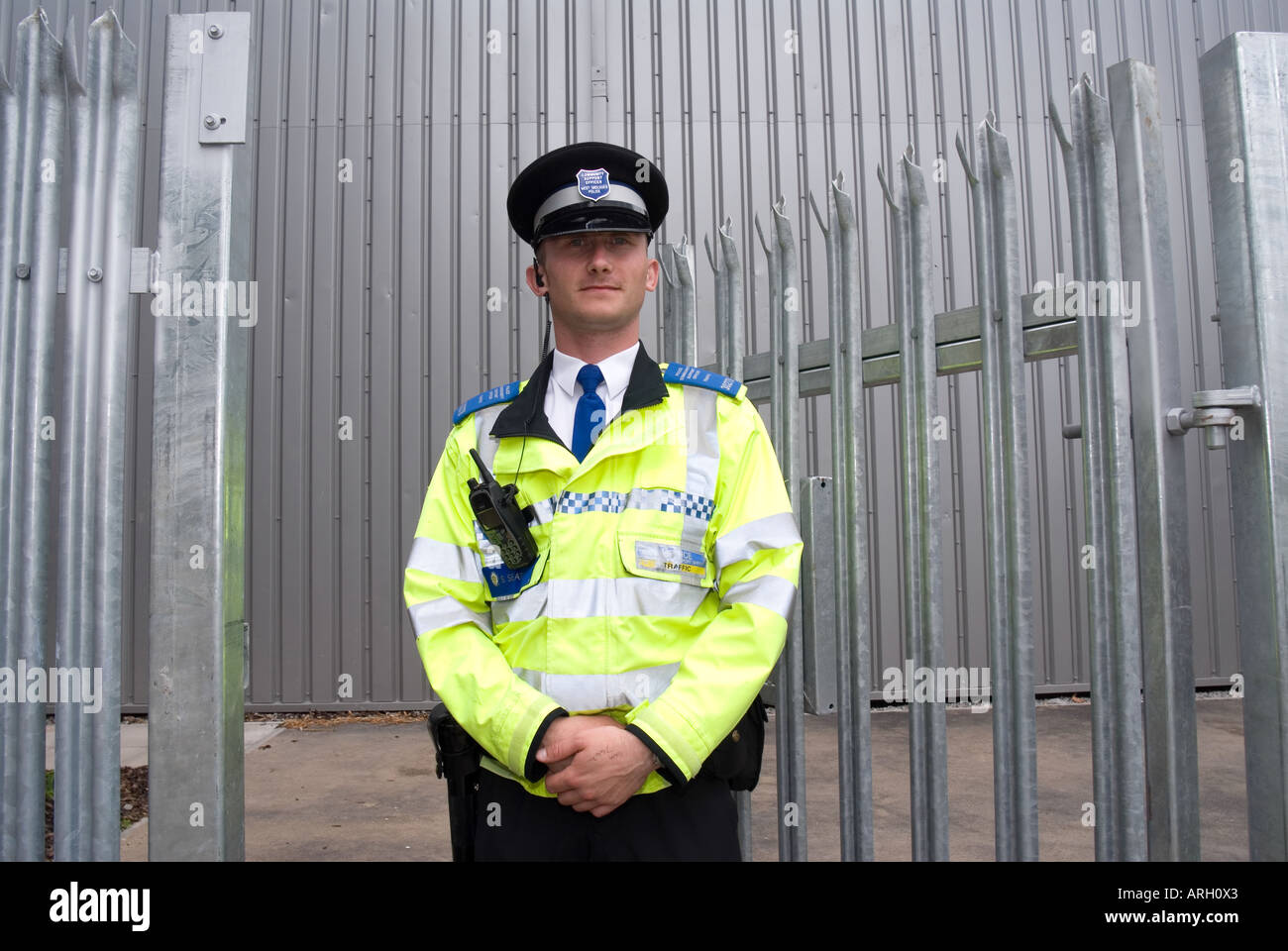 A police community support officer PCSO on duty in front of an open ...