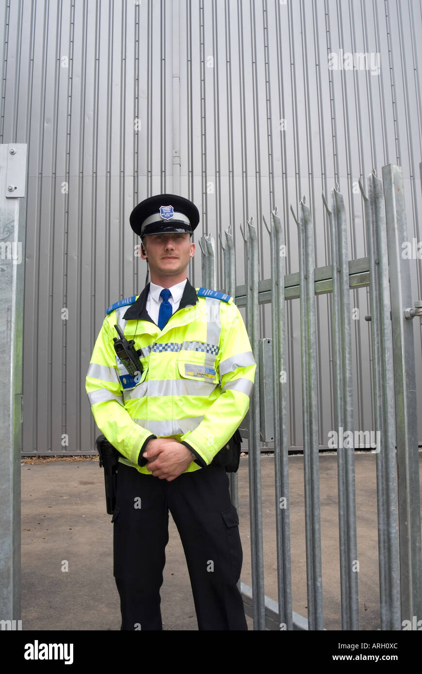 A police community support officer PCSO on duty in front of a warehouse ...