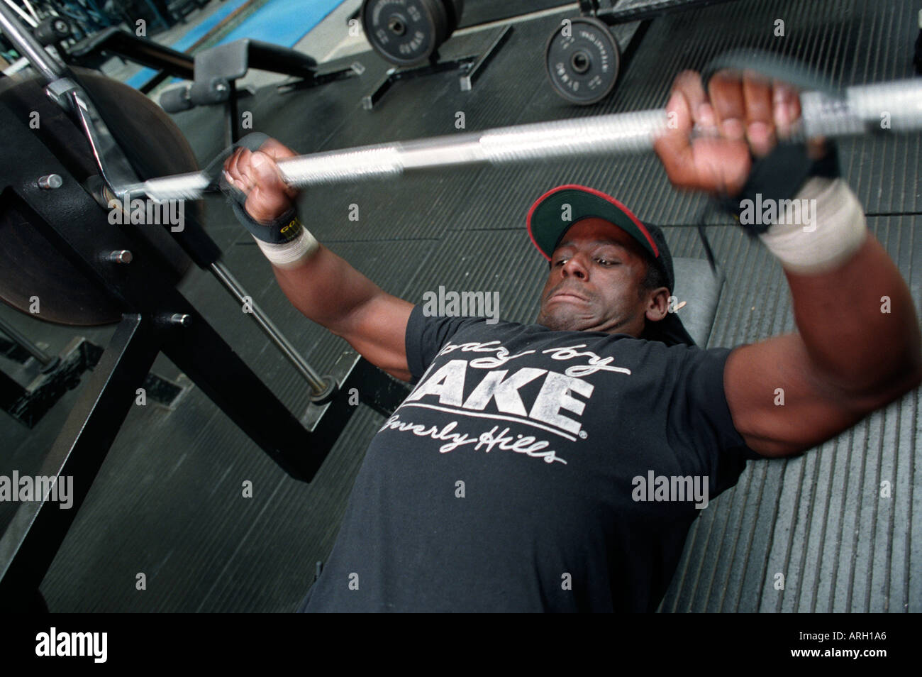 Keeping fit in a health club gym Stock Photo - Alamy