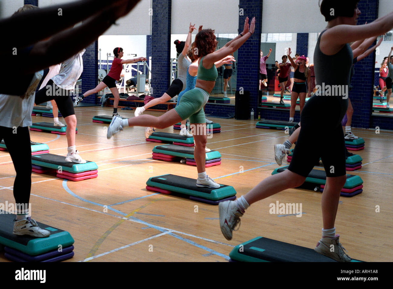 Keeping fit in a health club gym Stock Photo - Alamy