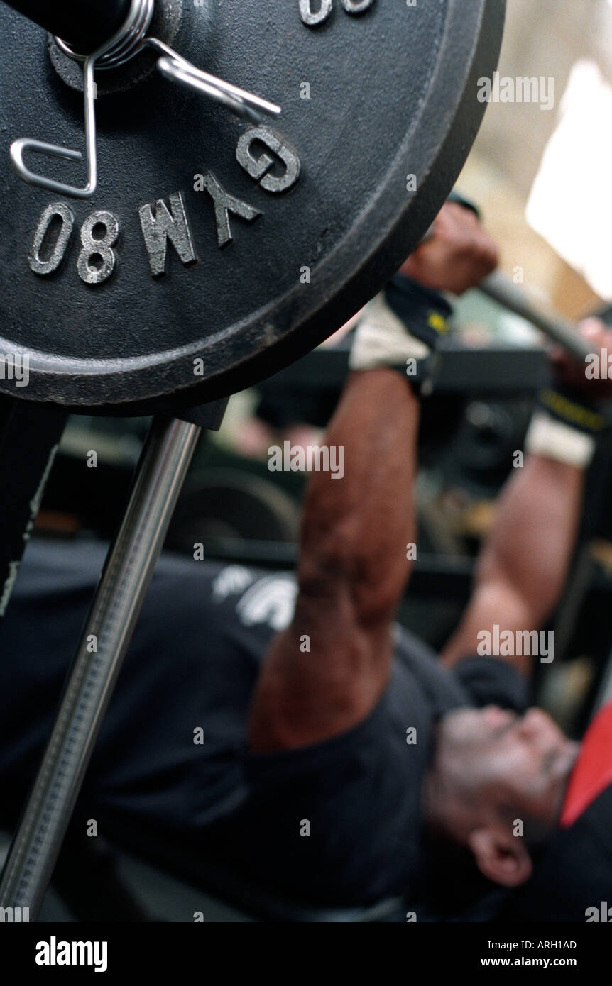 Keeping fit in a health club gym Stock Photo - Alamy