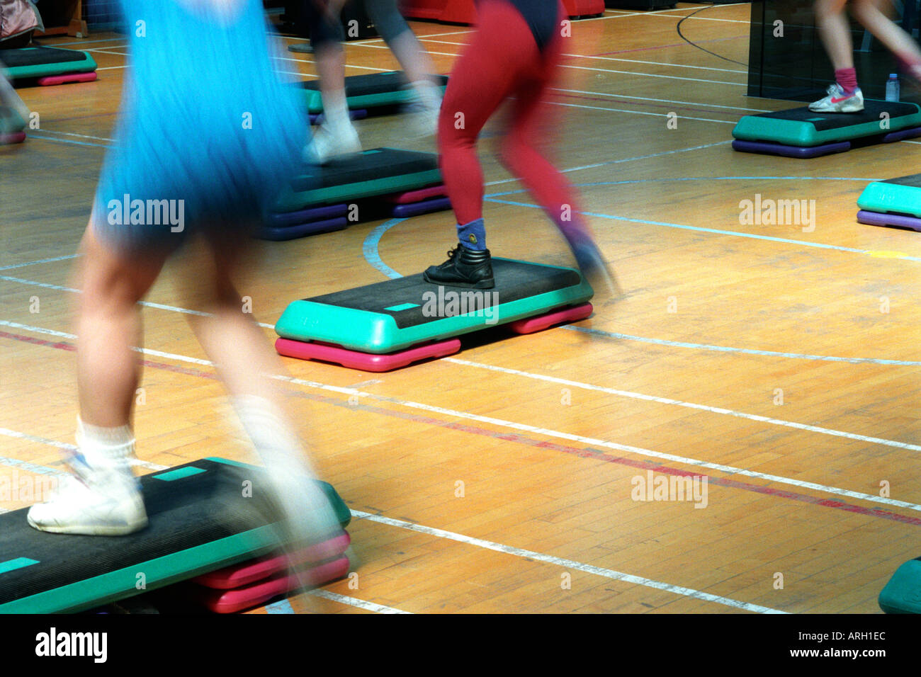 Keeping fit in a health club gym Stock Photo - Alamy