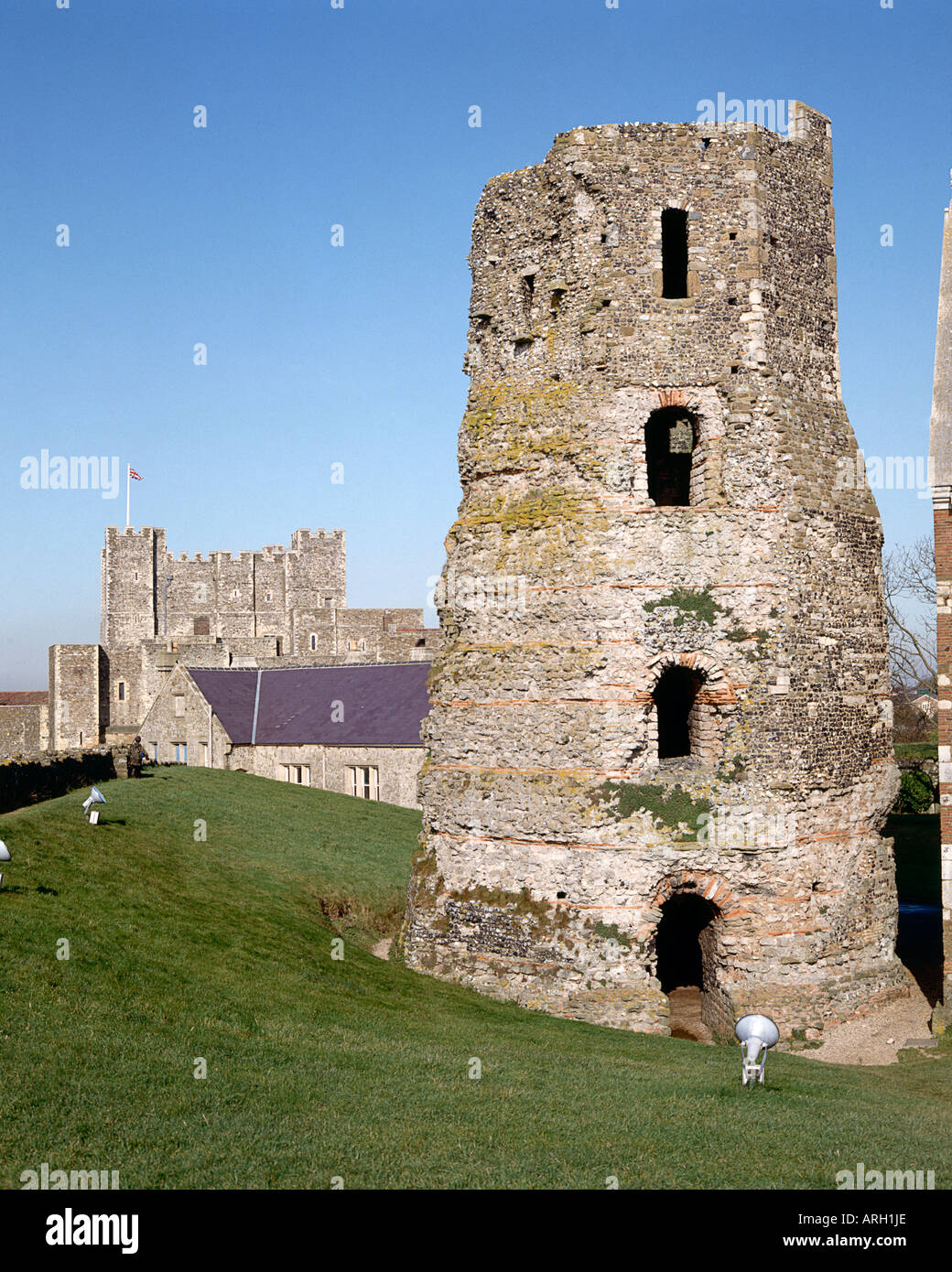 The tower of a Roman lighthouse stands beside the Saxon Church of St ...