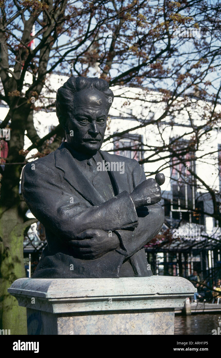 The austere bronze bust of Arthur van Schindel set in a tree lined park ...